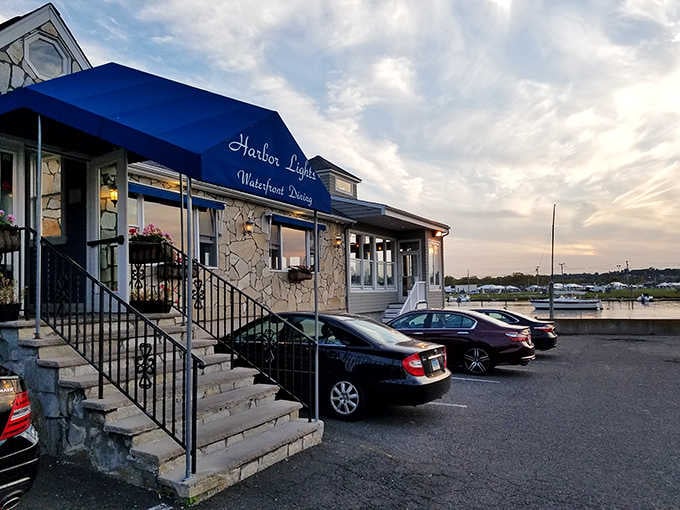 That blue awning and stone exterior at sunset says one thing clearly: something delicious is waiting inside.