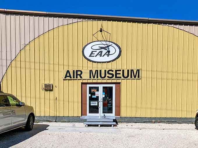That cheerful yellow hangar holds more history than most museums twice its size could ever dream of containing.