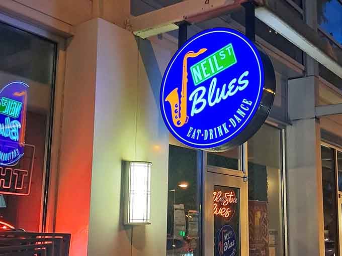 That glowing blue sign with a golden saxophone is basically Champaign's most delicious landmark, calling your name after dark.