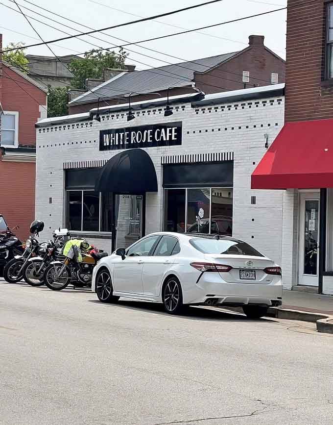 That bold black awning and crisp white brick say one thing loud and clear: breakfast is serious business here.