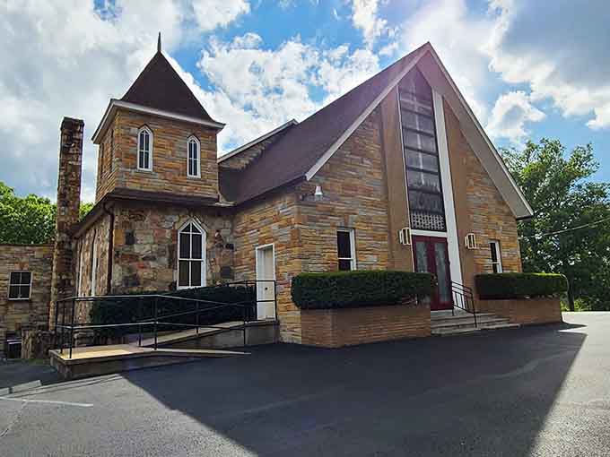 Stone walls, sharp steeple, and serious craftsmanship. This church looks like it was built to outlast everything around it.