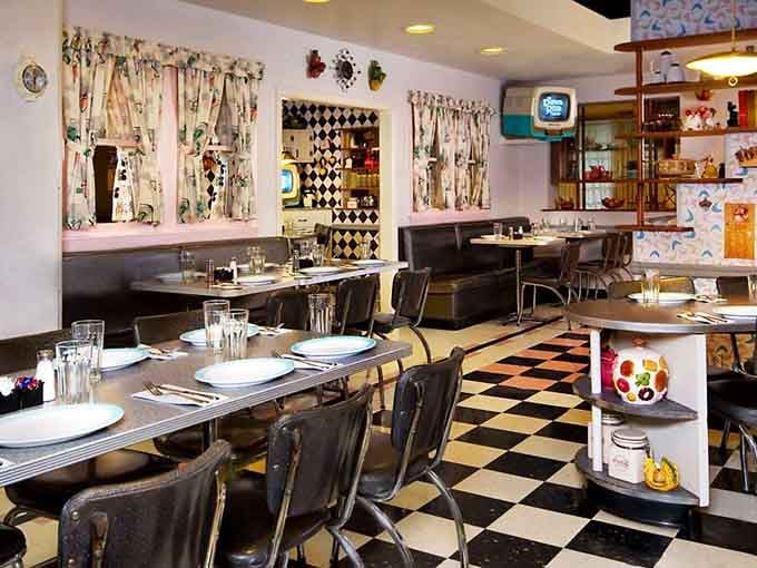 Curtained windows, checkered floors, and retro televisions in every corner. The 1950s called and they want you to stay for dinner.