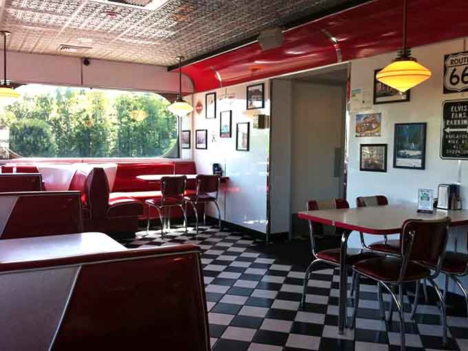Route 66 signs, warm pendant lights, and red booths that invite you to stay just a little longer.
