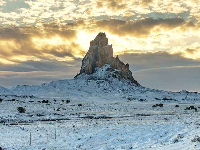 Winter whites blanket the desert floor, turning Agathla Peak into a scene from an unexpected snow globe.
