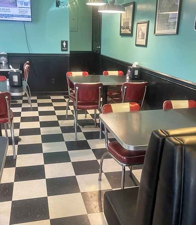 Red chairs, chrome tables, and that legendary checkered floor. This corner of Al's looks like a dream you've had before.