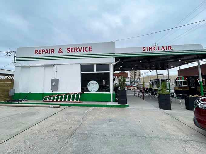 A vintage Sinclair station reinvented as a social gathering spot, where good company replaced motor oil permanently.