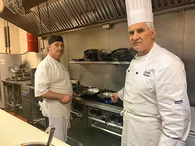 Two focused chefs, one serious flame, and a kitchen that clearly knows exactly what it's doing every single night.