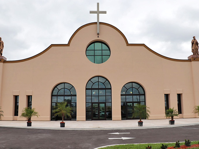 St. Paul's Catholic Church stands with graceful curves and soaring cross, a calm and welcoming presence anchoring this DeSoto County community.