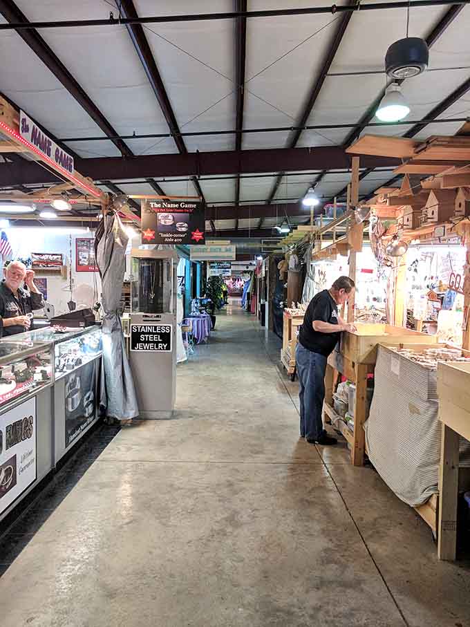 Long indoor aisles lined with vendors selling everything from stainless steel jewelry to handcrafted woodwork.