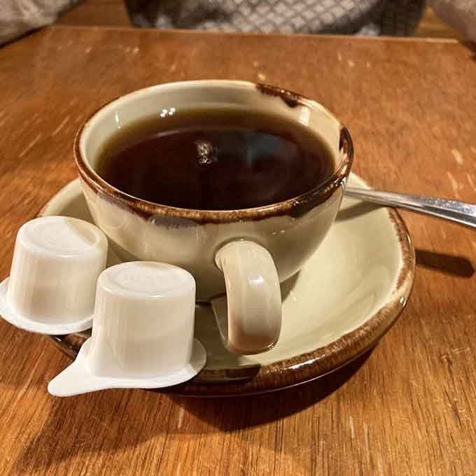 A proper ceramic cup of coffee, the kind that slows you down and reminds you to enjoy the moment.