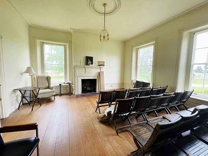 Wide-plank floors, tall windows, and folding chairs waiting patiently for the next group of curious visitors.