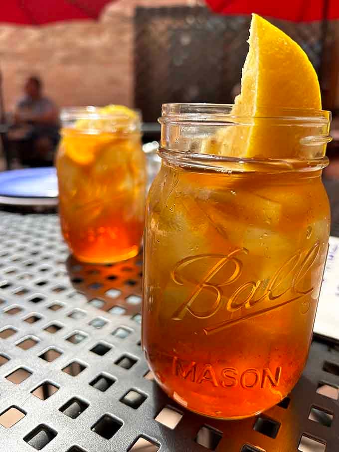 Iced tea in a Ball mason jar with an orange slice. Colorado mountain dining doesn't get more charming than this.