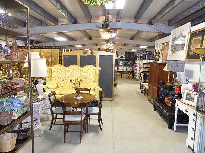 A floral settee, round tables, and wicker baskets create a living room scene nobody wants to leave.
