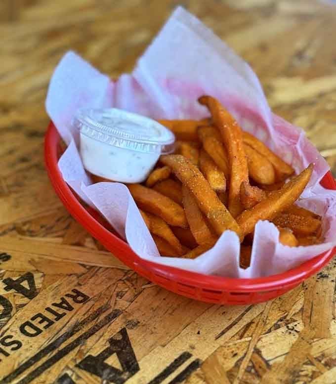 Sweet potato fries in a red basket with a creamy dipping sauce. Simple, warm, and exactly what your hands needed to be holding right now.