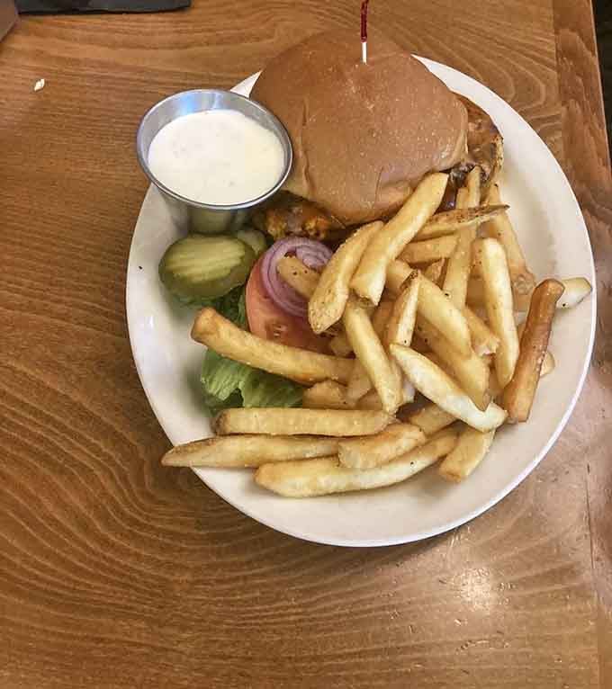 A proper burger with all the fixings, golden fries, and a side of ranch, because some classics just don't need improving.