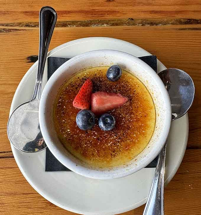 Cr&egrave;me br&ucirc;l&eacute;e with fresh berries and that satisfying caramelized sugar crack is brunch dessert goals.