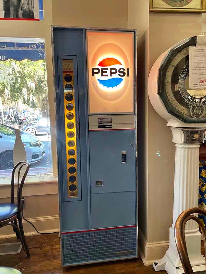 A vintage Pepsi vending machine, still glowing, still standing tall, like a jukebox that never learned to quit.