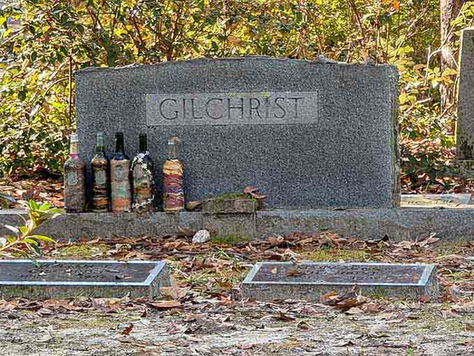Someone left bottles at the Gilchrist grave, which is either deeply touching or the best party invitation ever written.