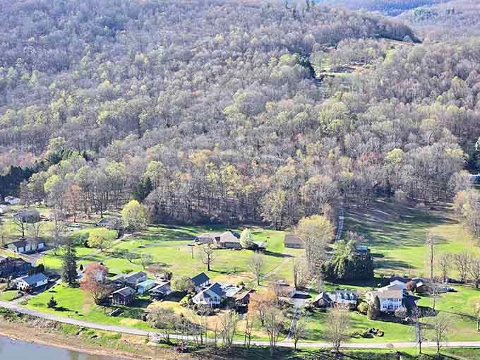 From high above, the riverside homes and seasonal cottages look like a peaceful little world completely unbothered by everything else.