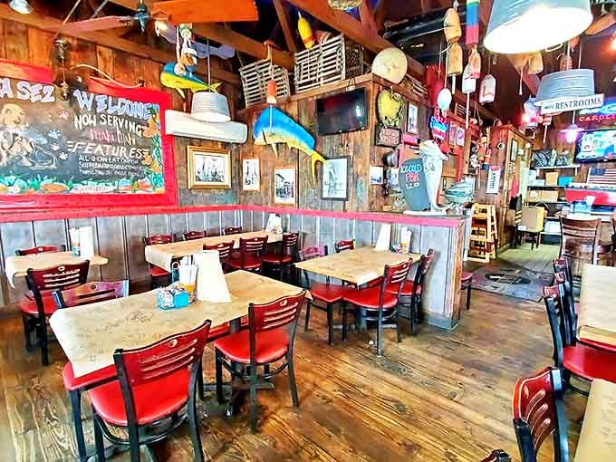 Rustic wood floors, red chairs, fish mounts on the walls. This dining room tells you a story before you even sit down.