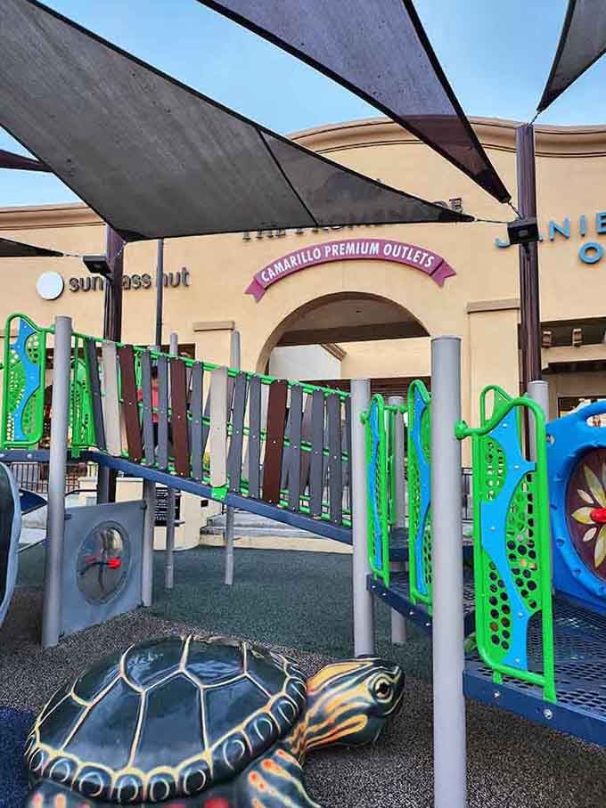 A shaded kids' playground right inside the outlets. Parents shop, kids play. Everybody wins. Genuinely brilliant planning.