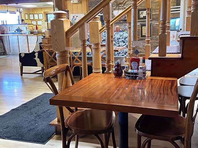 Polished wood tables, classic condiments, and a staircase that says this place has real personality and genuine soul.