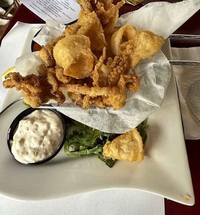 Crispy fried calamari with a side of creamy dipping sauce, simple, satisfying, and gone faster than you'd expect.