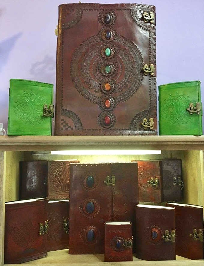 Leather-bound journals with gemstone clasps, because your spiritual journey deserves better than a spiral notebook.