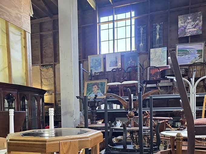 Paintings stacked like a museum that decided rules were optional, and honestly, it works beautifully.