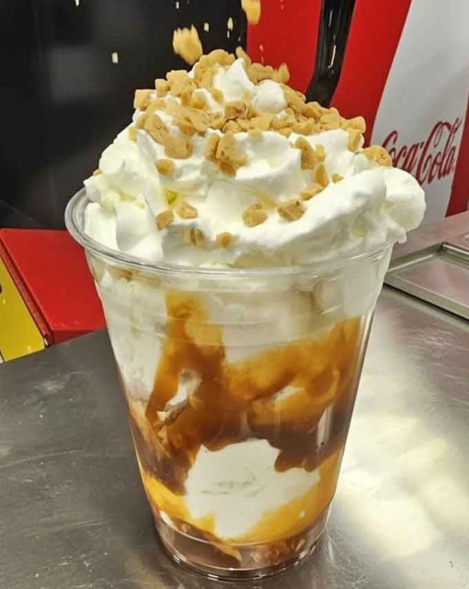 Caramel sauce, crushed nuts, and a mountain of whipped cream. This sundae arrived and immediately demanded your full attention.