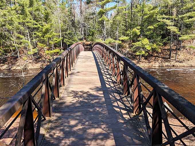 That bridge isn't just a crossing, it's an invitation to walk straight into one of Wisconsin's best-kept secrets.
