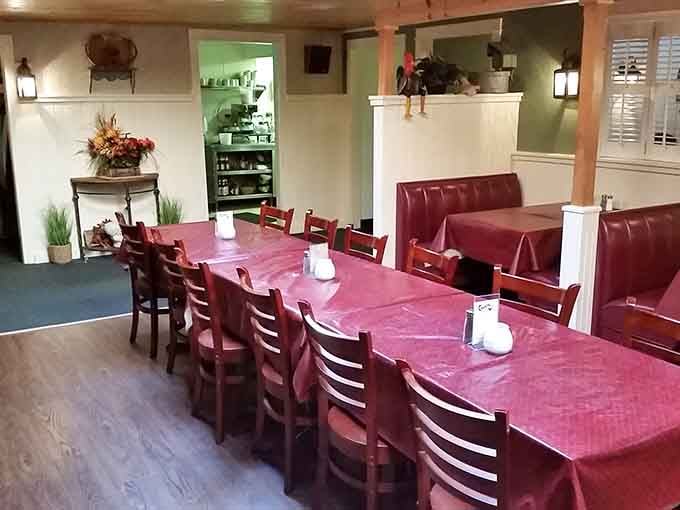 Red tablecloths, cozy booths, and a rooster keeping watch. Crandall's second dining room is just as inviting as the first.
