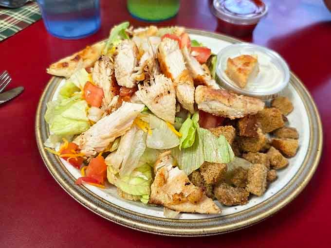 Grilled chicken salad loaded with tomatoes and croutons. Proof that lunch here means serious business too.