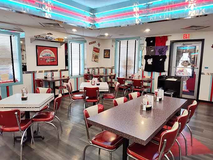 Vintage pennants, Coca-Cola signs, and red booths, every corner of this place earns its keep.