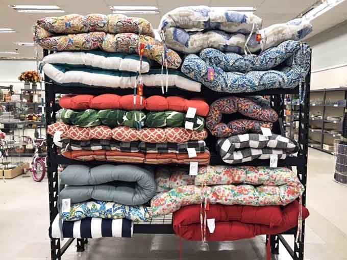 A rainbow of outdoor cushions stacked high, your patio furniture has been waiting for exactly this moment.