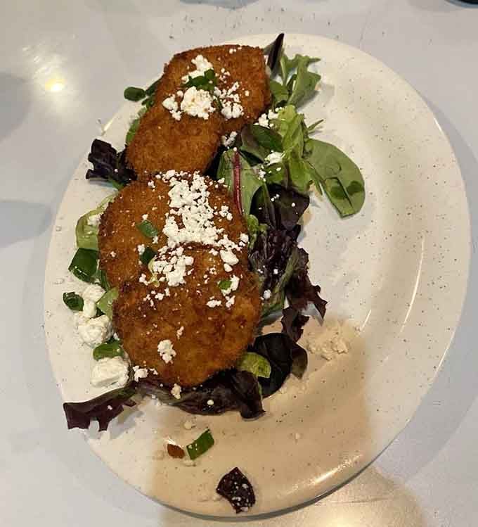 Crispy, golden, and topped with crumbled cheese over fresh greens. These fried green tomatoes are Southern cooking at its most charming.