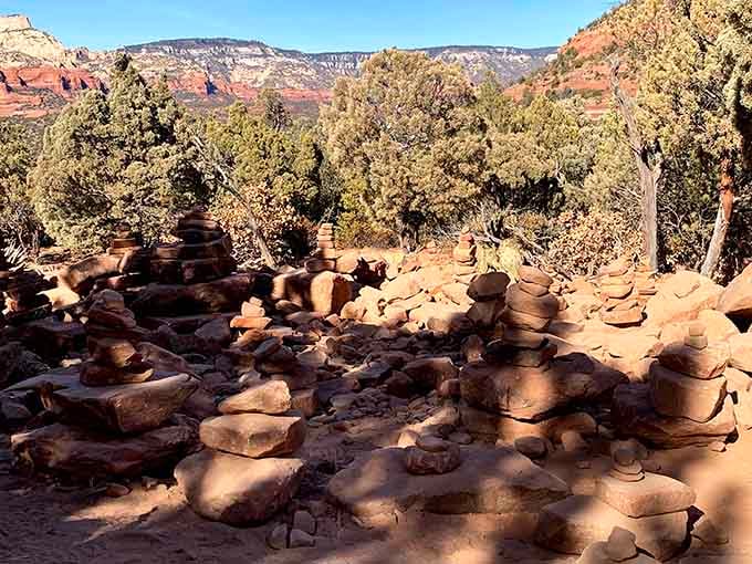 Someone stacked these rocks with patience and intention. The canyon walls behind them have been doing the same thing for millions of years.