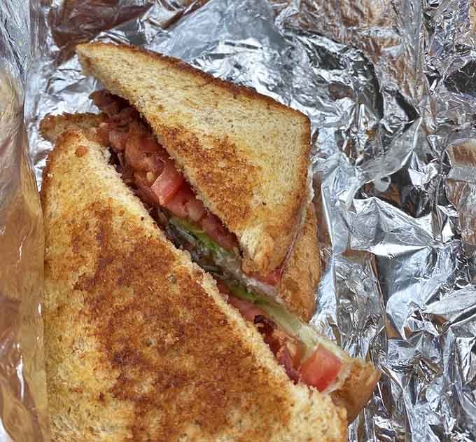 A BLT so perfectly toasted and stacked, it could teach a master class in sandwich architecture and structural integrity.
