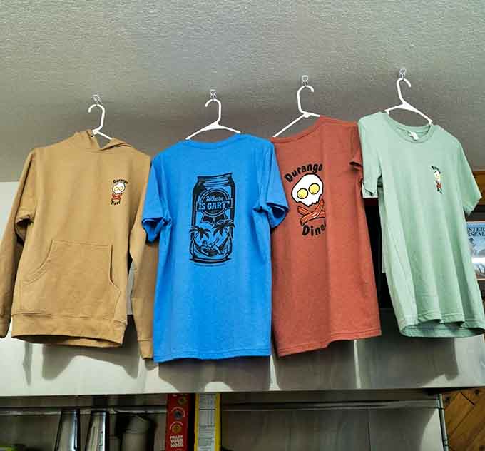 Four shirts hanging like a tiny gallery, including one asking "Where Is Gary?" which is honestly a question worth investigating.