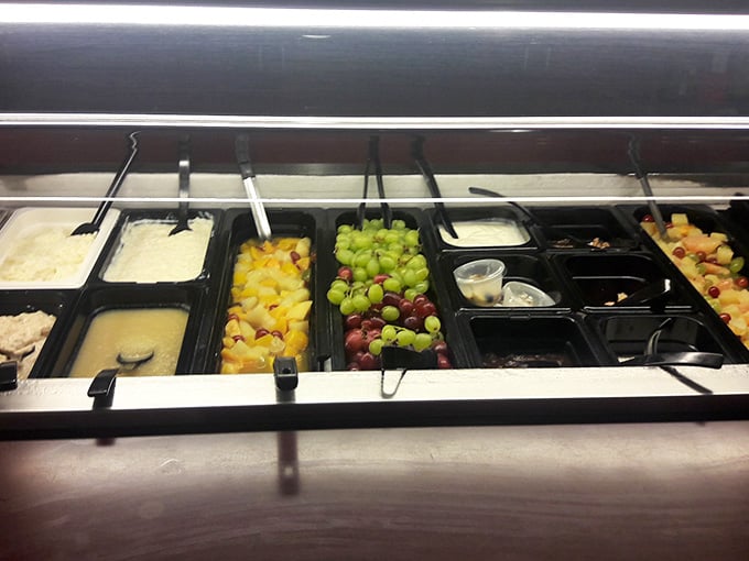 Fresh grapes, diced fruit, and chilled salads lined up neatly. The cold bar here is a quiet overachiever nobody talks about enough.