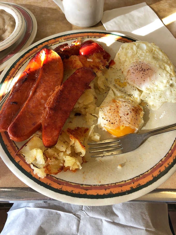 Polish sausage, country fries, and two eggs sunny-side up. This breakfast plate means serious business.
