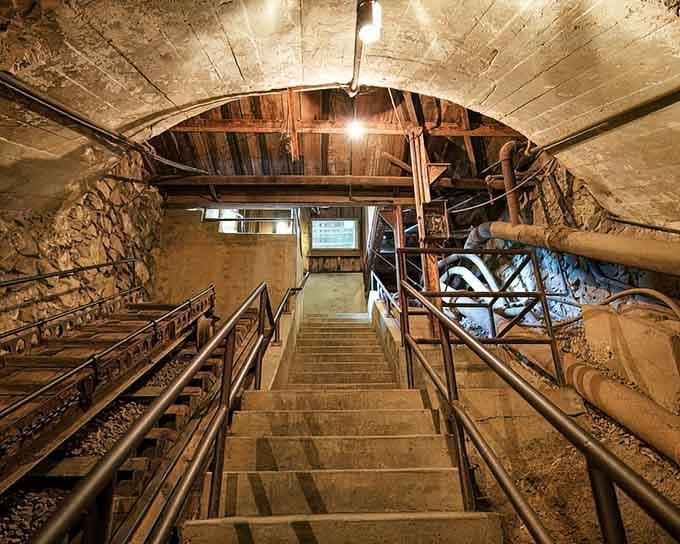 Real mine shaft stairs leading into the earth. This is where California's gold story got very serious, very fast.