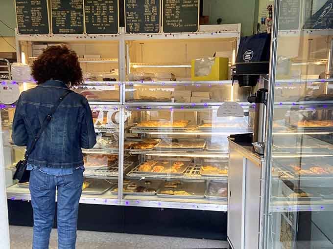 That moment of standing before a full display case, weighing your options, is one of life's great quiet pleasures.