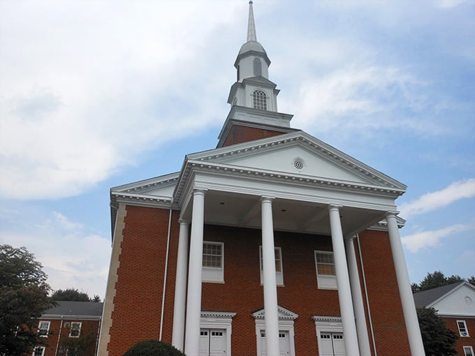 White columns and a soaring steeple create the quintessential Southern church, straight from a Norman Rockwell painting.