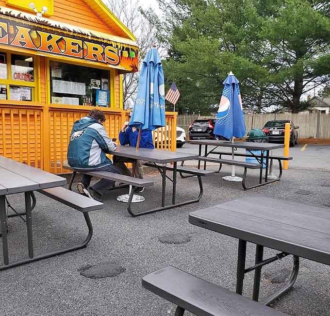 Picnic tables and colorful umbrellas create the perfect casual dining atmosphere for devouring tacos without any pretense whatsoever.