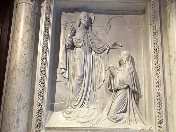 Carved in marble, this relief panel is the kind of artwork that makes you stop mid-sentence.