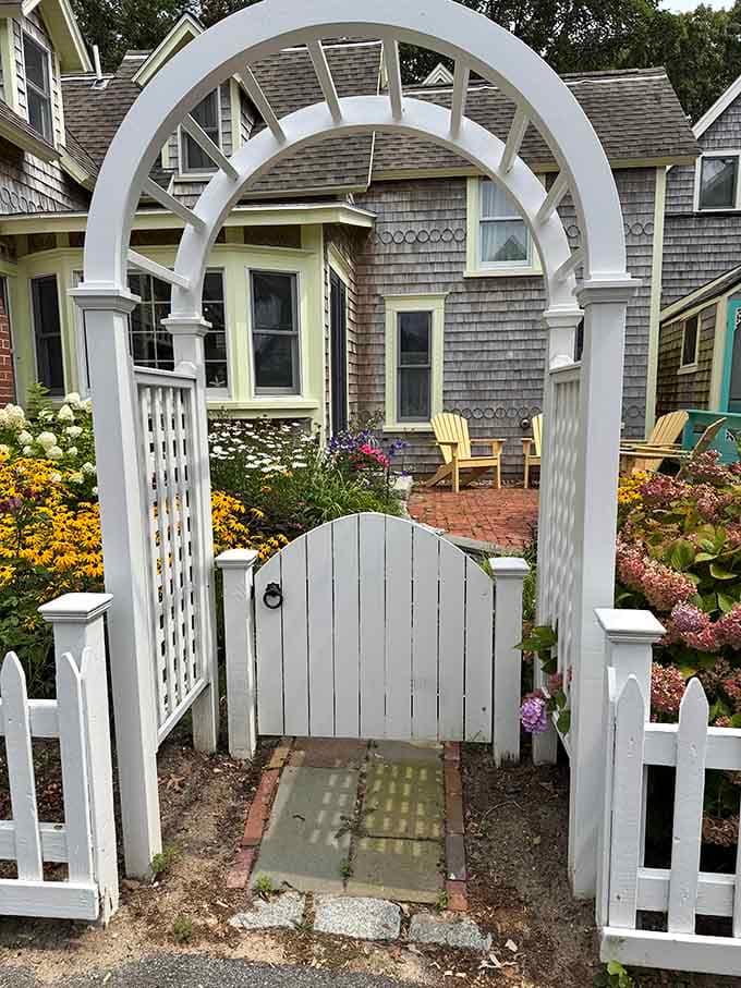A white garden gate, Adirondack chairs, and hydrangeas in full bloom. Some invitations don't need words.
