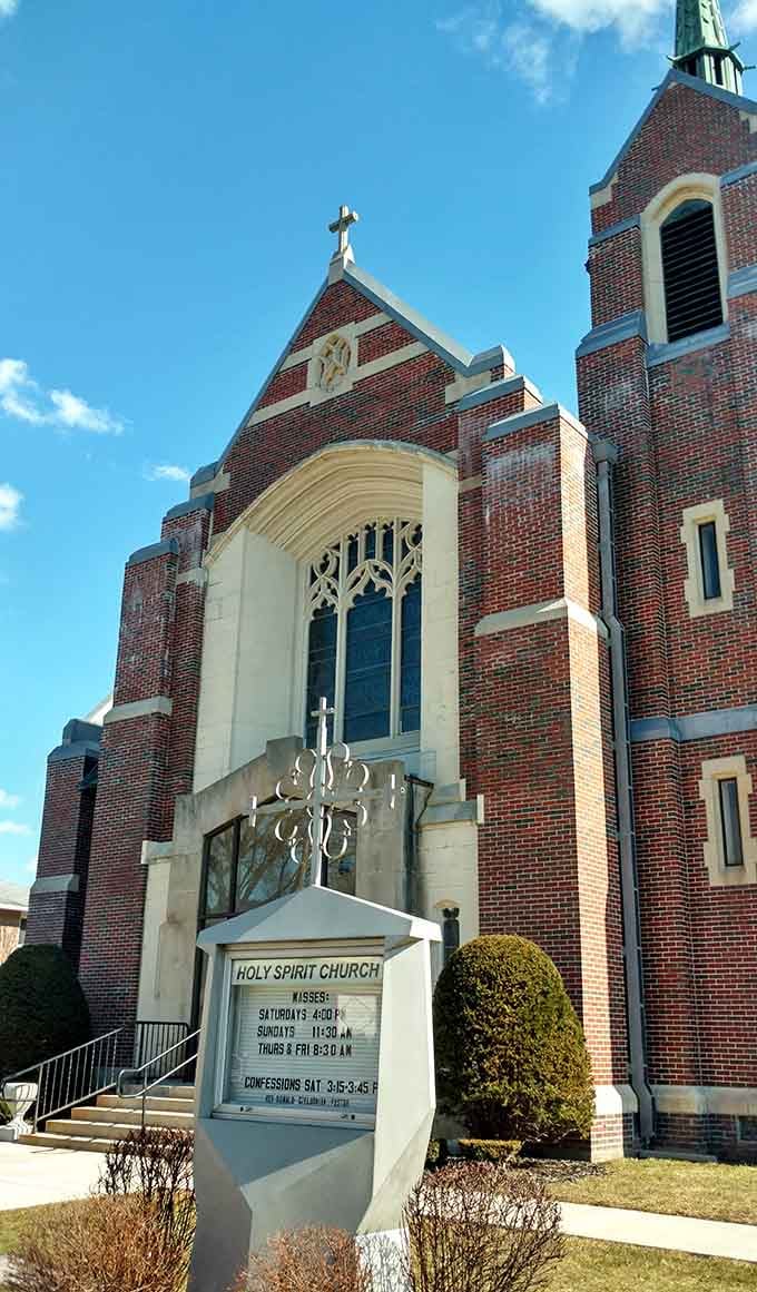 Gothic Revival brickwork reaches skyward with intricate stonework that modern construction budgets can only dream about creating.