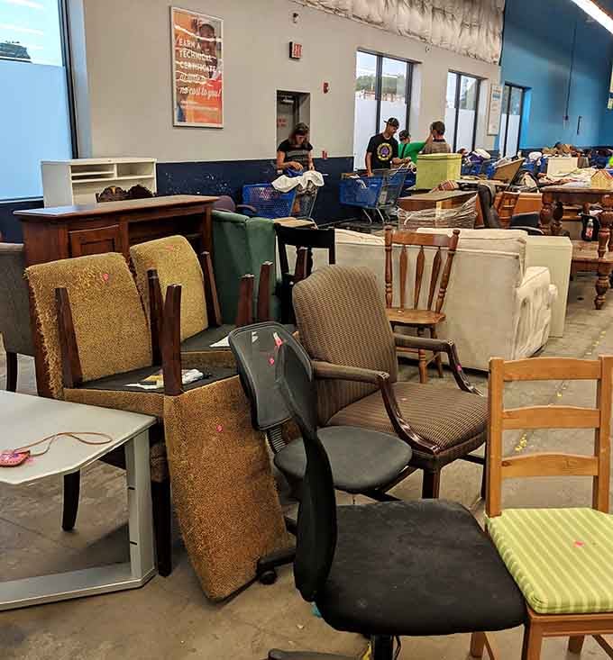 Chairs of every shape and style lean against each other like they're all waiting for the same bus.