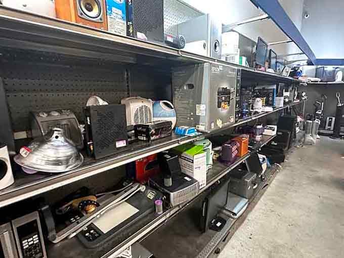 Electronics of every kind lined up on shelves, quietly waiting for someone to give them a well-deserved second life at home.